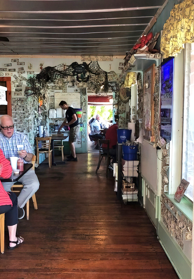 Dollar bills and fishing nets line walls that have witnessed countless seafood celebrations. This isn't d&eacute;cor&mdash;it's a maritime museum with table service.