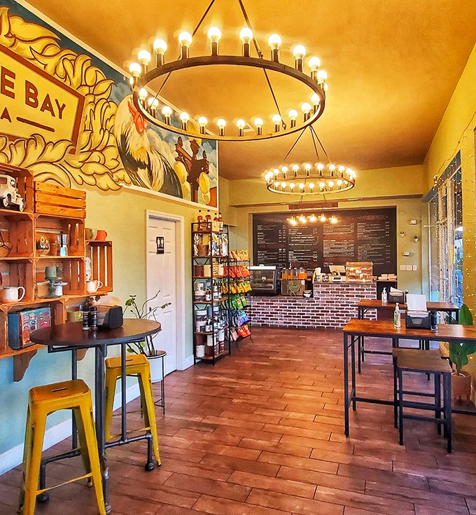 Golden walls and circular chandeliers create the perfect backdrop for sandwich artistry&mdash;Edison would approve of both the lighting and lunch options.