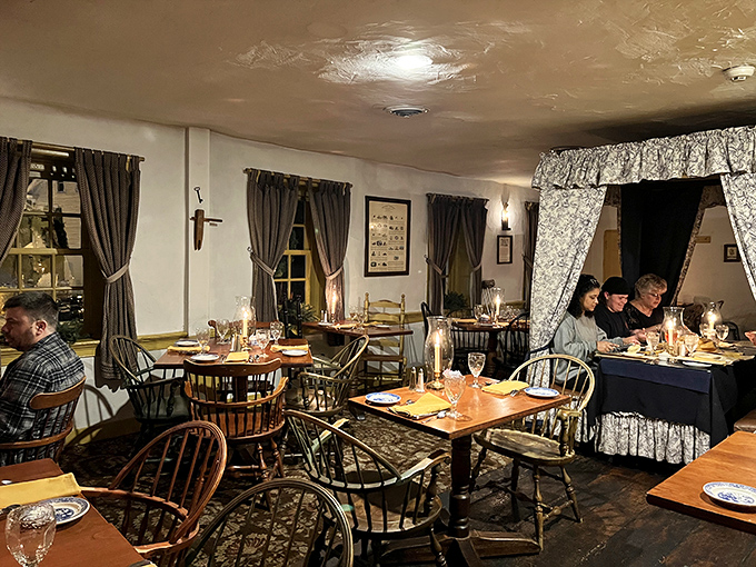 Candlelight dining isn't just romantic—it's time travel. Windsor chairs and colonial decor create an atmosphere where both Washington and Lincoln would feel right at home.