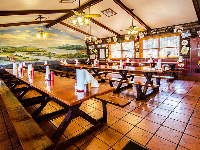 Picnic tables and pastoral murals create the perfect backdrop for the serious business of barbecue consumption. No pretension, just pure comfort.