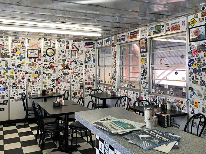 Sticker-covered walls tell thousands of stories, creating a living museum of memories where every inch has earned its character.