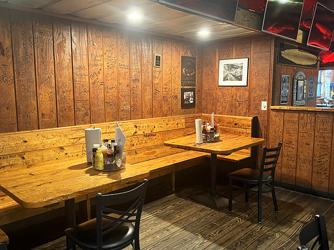 Wood-paneled walls covered in decades of signatures tell stories that rival the menu. Every inch of this tavern has character.