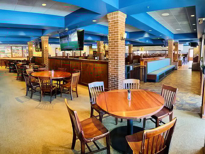 The bright blue ceiling and warm wood tones create that perfect balance of "modern supper club" &ndash; comfortable yet contemporary.