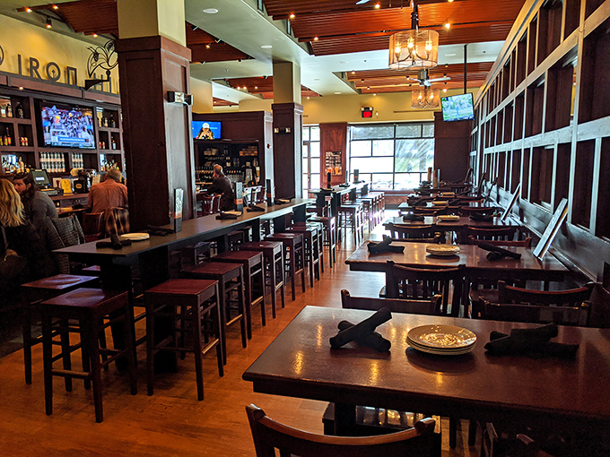 Warm wood tones and strategic lighting create that perfect "I could stay here all afternoon" vibe that great brewpubs master.