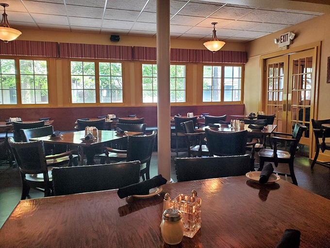 Warm wood tones and comfortable seating create the perfect backdrop for the main event: food that makes conversation pause mid-bite.
