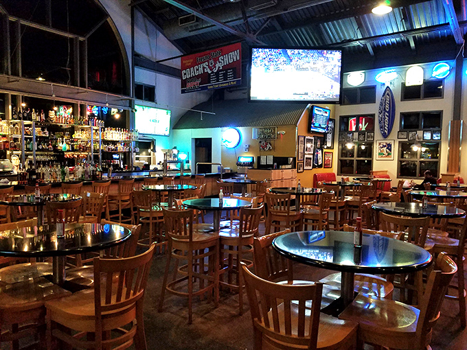 Inside, warm wood tones and multiple screens create the perfect backdrop for serious comfort food conversations.