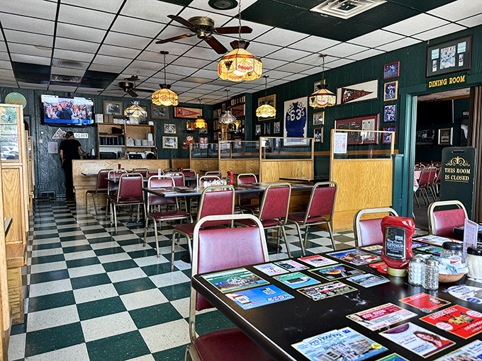 Step inside where checkered floors and vintage lighting create the perfect backdrop for memorable meals.