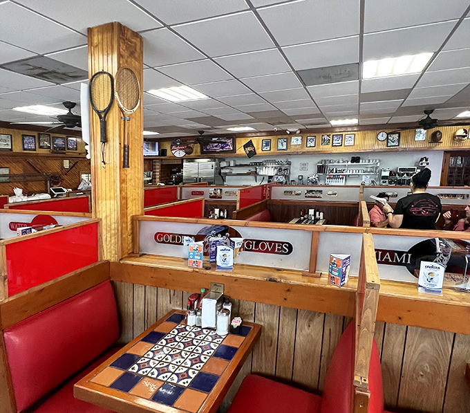 Inside, wooden booths adorned with sports memorabilia create that perfect blend of nostalgia and comfort&mdash;like dining in your favorite uncle's trophy room.