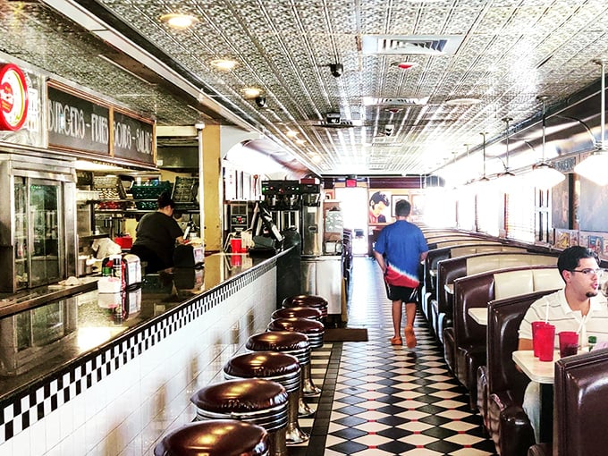 Step inside and the 1950s welcome you with open arms. That black and white checkered floor isn't just decoration&mdash;it's your invitation to the dinner table of American nostalgia.