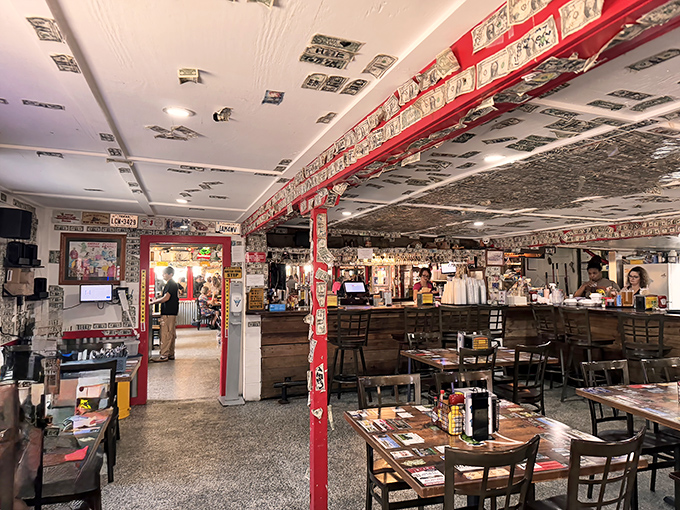 Step into a time capsule where dollar bills paper the ceiling and memories stick to every surface.