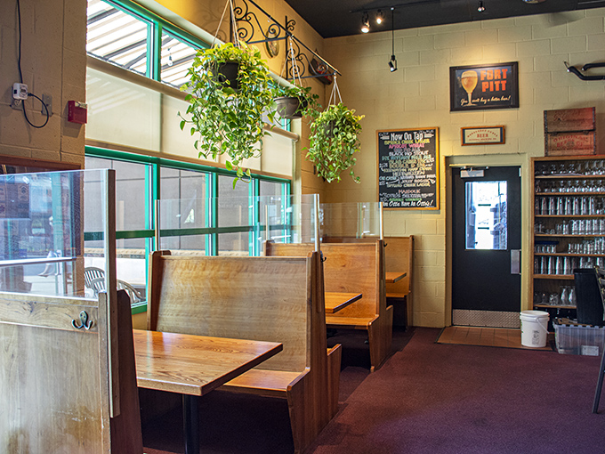 Cozy wooden booths create intimate spaces where beer conversations flow as smoothly as the taps.