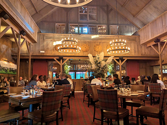 Soaring wooden beams and circular chandeliers create a space that somehow feels both grand and cozy—like Architectural Digest met Midwest hospitality and they fell in love.