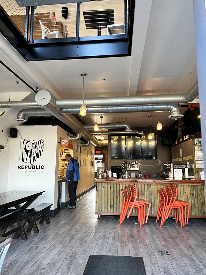 Inside, industrial chic meets cozy caf&eacute;. Those bright orange chairs aren't just for sitting&mdash;they're your front-row seats to pastry paradise.