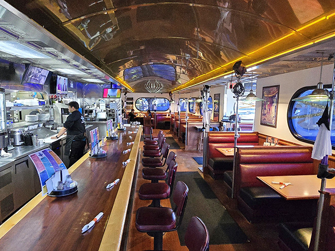 Step inside this authentic dining car where red vinyl booths and chrome fixtures create pure nostalgic magic.