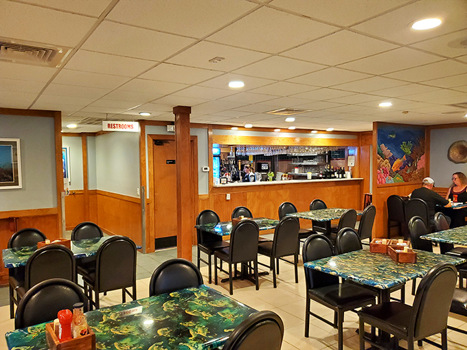 Simple tables with underwater-themed patterns set the stage for seafood drama. No white tablecloths needed when the star of the show is what's on your plate.