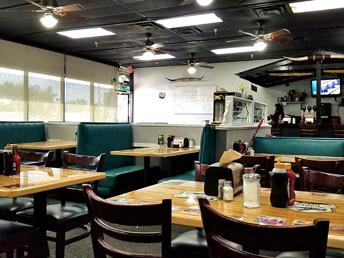 Classic teal booths and wooden tables create that perfect diner atmosphere where conversations flow as freely as the coffee refills.