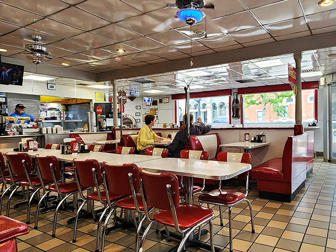 Classic red vinyl booths and chrome-trimmed tables transport diners to simpler times, when conversations flowed as freely as the coffee refills.