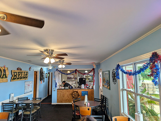 Blue walls, ceiling fans, and nautical touches create the perfect seafood sanctuary. This isn't designer coastal chic&mdash;it's the real Florida, where the focus stays squarely on what matters. 