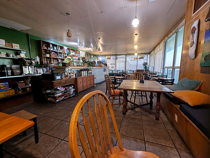 Inside, mismatched tables and wooden chairs create the kind of authentic coziness that corporate chains spend millions trying to replicate but never quite capture.