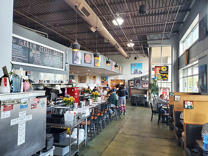 Industrial chic meets neighborhood comfort&mdash;exposed ceilings, colorful art, and that unmistakable breakfast energy filling every corner.