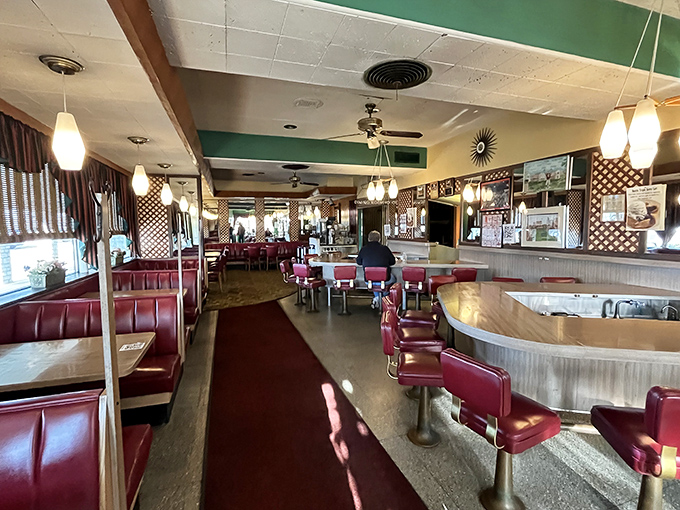 Red vinyl booths and counter stools that have witnessed decades of local gossip. This isn't retro by design&mdash;it's authentic by persistence.