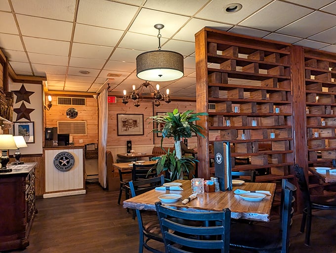 Wooden lattice dividers and warm lighting create intimate dining spaces without sacrificing the convivial atmosphere that makes steakhouse dining special.
