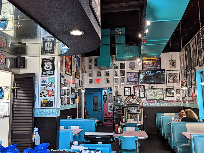 Wall-to-wall nostalgia meets turquoise dream in this diner where every inch tells a story and every booth promises a delicious flashback.