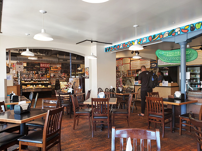 Inside, wooden chairs and tables create that perfect "everybody knows your name" vibe, while the giant pickle sign reminds you why you came.