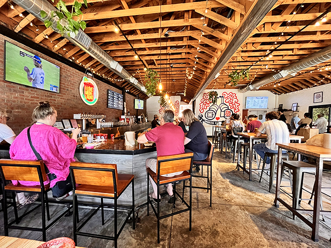Exposed wooden beams and brick walls create the perfect rustic-meets-urban vibe, where beer flows and conversation buzzes as freely as the BBQ smoke outside.