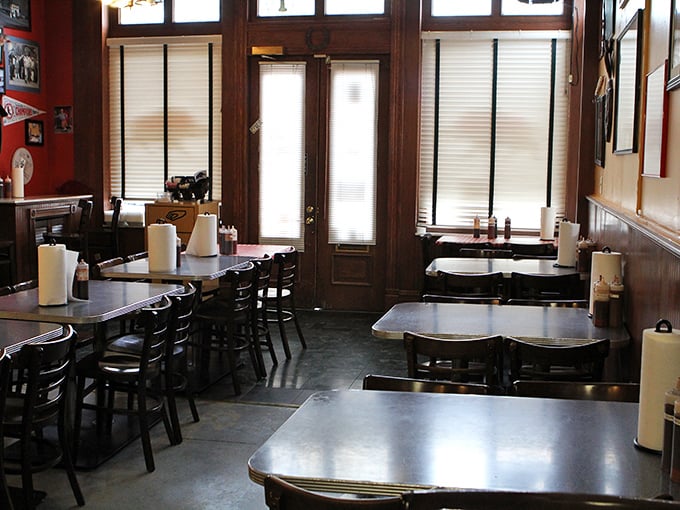 Simple tables, red walls, and the promise of meat magic. No white tablecloths here—just the perfect stage for barbecue brilliance to shine.