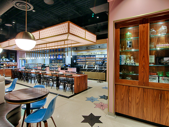 Inside, mid-century modern meets contemporary chic with geometric floor tiles, warm wood accents, and lighting fixtures that would make Don Draper nod in approval.