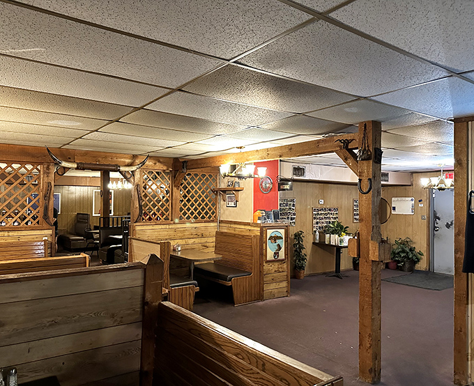 Wooden booths and lattice dividers create the perfect balance of privacy and ambiance&mdash;like your favorite uncle's basement, if your uncle were a steak wizard.