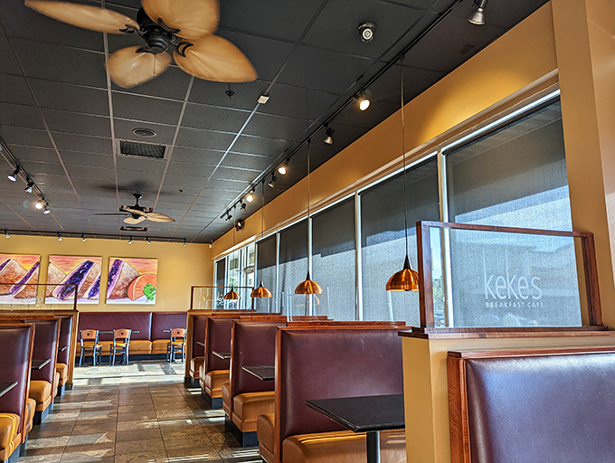 Step inside where warm lighting and cozy booths create the perfect breakfast sanctuary atmosphere.