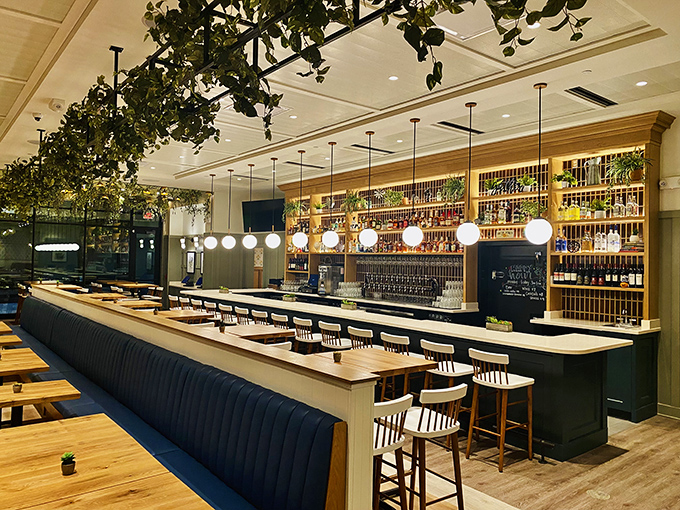 The bar at Tupelo Honey isn't just stocked&mdash;it's a liquid library where botanical ceiling touches remind you that good spirits grow from the earth.
