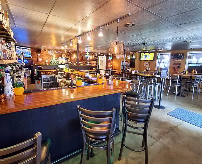 The bar at Sparky's isn't just a counter&mdash;it's command central for culinary happiness, where wood-paneled walls hold stories as rich as their sauces.