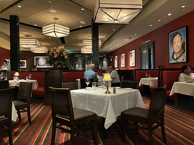 Red walls, crisp linens, and lighting that flatters everyone. The dining room whispers "special occasion" even on a random Tuesday.