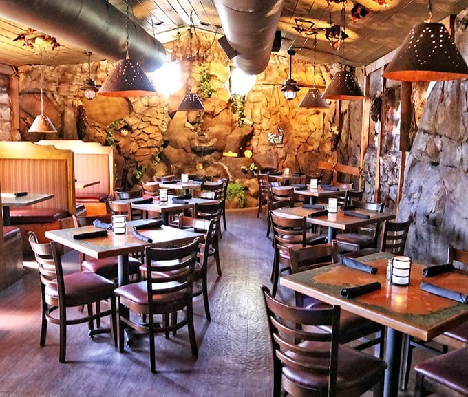 Not your average dining room! Stone walls and stalactite-inspired lighting transform an ordinary meal into a subterranean feast worthy of Batman's more food-obsessed cousin.