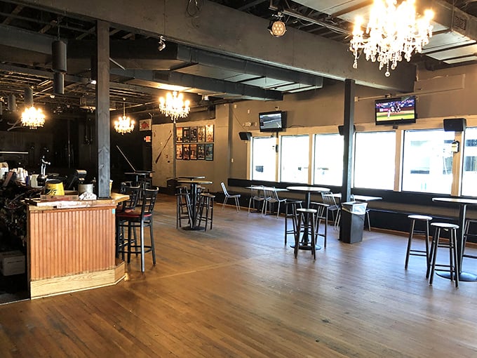 Chandeliers over wooden floors? It's like your fancy aunt married a sea captain and this is their living room&mdash;elegant yet approachable.
