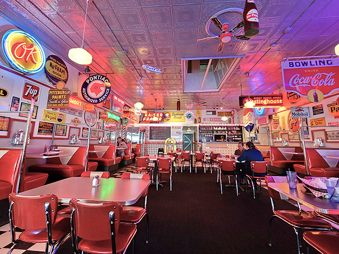Step inside and the neon glow bathes everything in that perfect nostalgic light, where vintage signs aren't decorations but witnesses to decades of memorable meals.