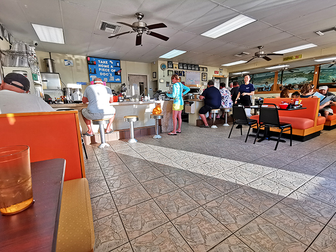 Step inside where orange booths and checkered floors create the perfect backdrop for morning magic and memorable meals.
