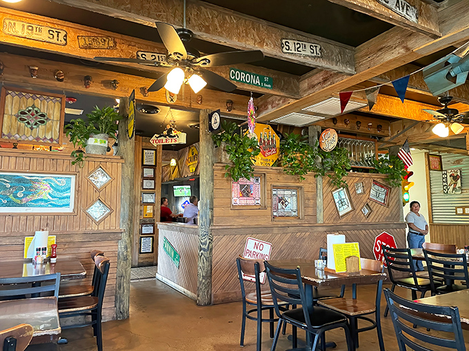 Inside Tookie's, street signs and greenery create that perfect "been-here-forever" vibe where memories are made between bites of legendary burgers.