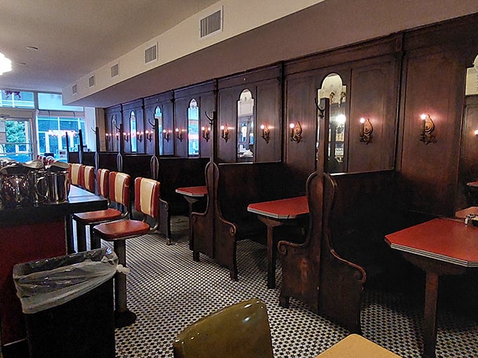Red vinyl meets chrome in this quintessential diner interior. Those stools aren't just seats&mdash;they're front-row tickets to the breakfast show.