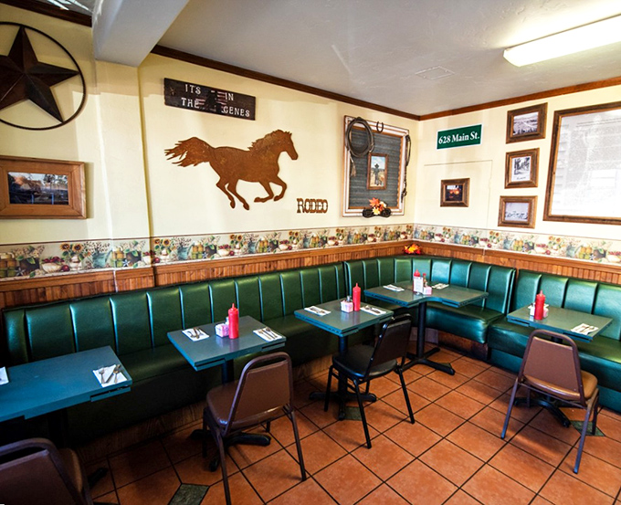 Western charm meets comfort food haven. The rustic horse silhouette and green vinyl booths create the perfect backdrop for serious breakfast decisions.