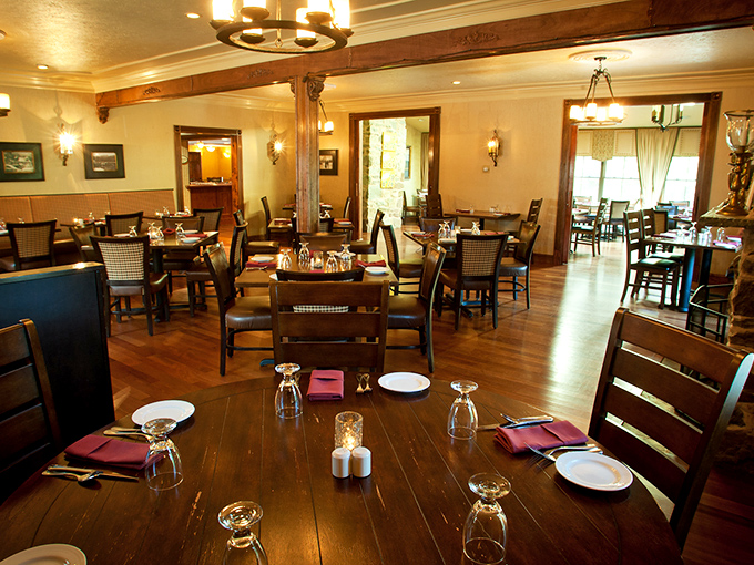 Warm wooden beams and thoughtful lighting transform this dining room into a sanctuary of comfort, where every table feels like the best seat in the house.