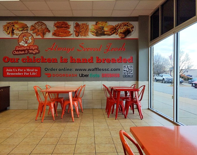 Simple orange chairs and clean tile floors set the stage where the real star—that heavenly fried chicken—can shine without distraction.