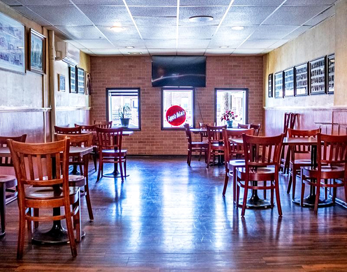 Simple wooden chairs, brick walls, and warm lighting create that rare atmosphere where you instantly feel like a regular, even on your first visit.
