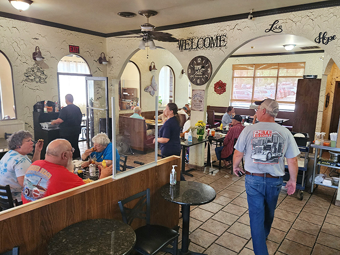 Step inside and the "WELCOME" sign isn't just decoration—it's a promise. The cozy interior with its arched doorways invites you to settle in and stay awhile.