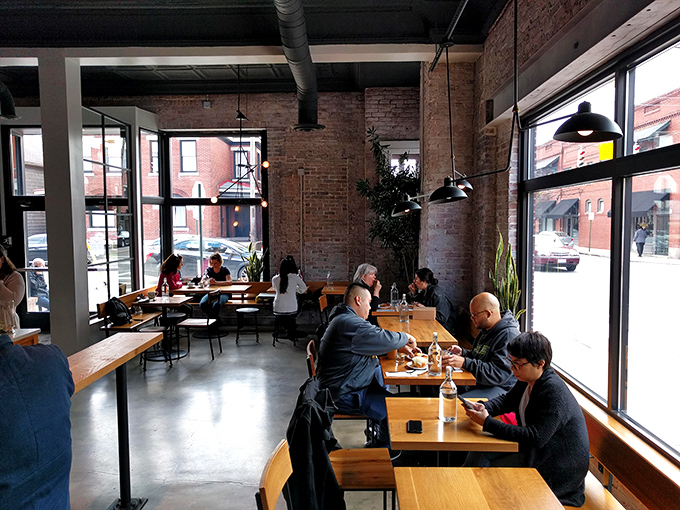 Industrial-chic meets comfort in this light-filled sanctuary. The exposed brick walls have witnessed countless first dates and "I can't believe how good this is" moments.