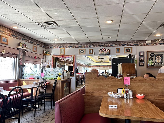 Inside Terry's, burgundy vinyl booths and wood paneling create that perfect diner atmosphere where conversations flow as freely as the coffee refills.
