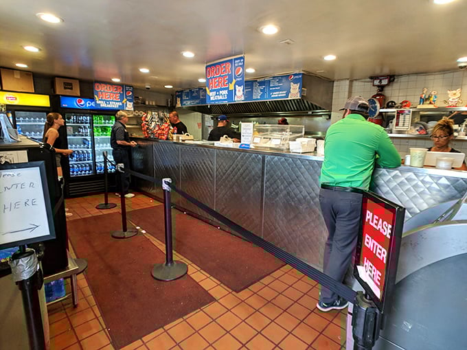 Inside, the no-nonsense counter setup is a temple of efficiency. Like NASA for sandwiches, every movement here has purpose.